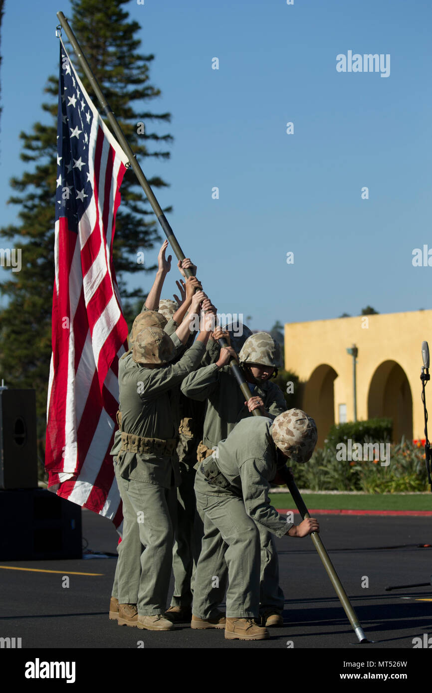 U.S. Marines with Headquarters and Service Battalion reenact raising ...