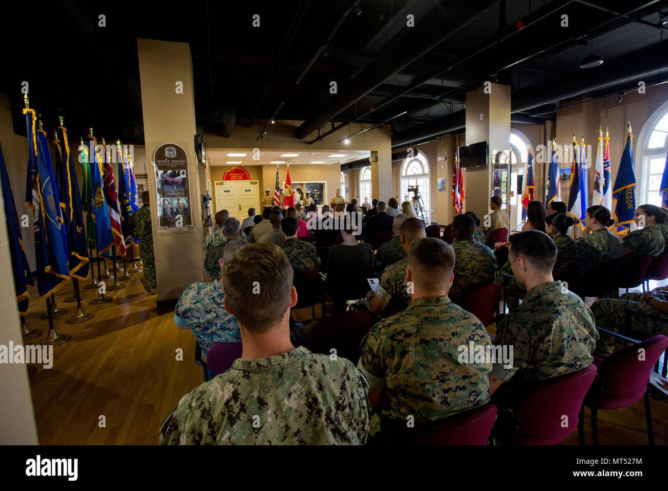 U.S. service members and civilians attend a retirement ceremony at ...