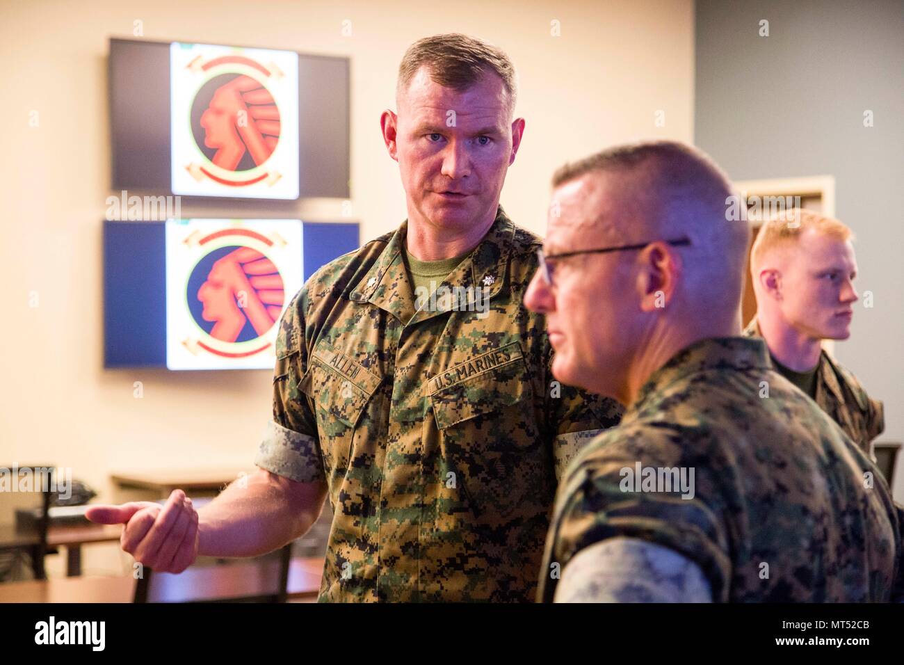 U.S. Marine Corps Lt. Col. Ryan P. Allen, left, commanding officer of ...