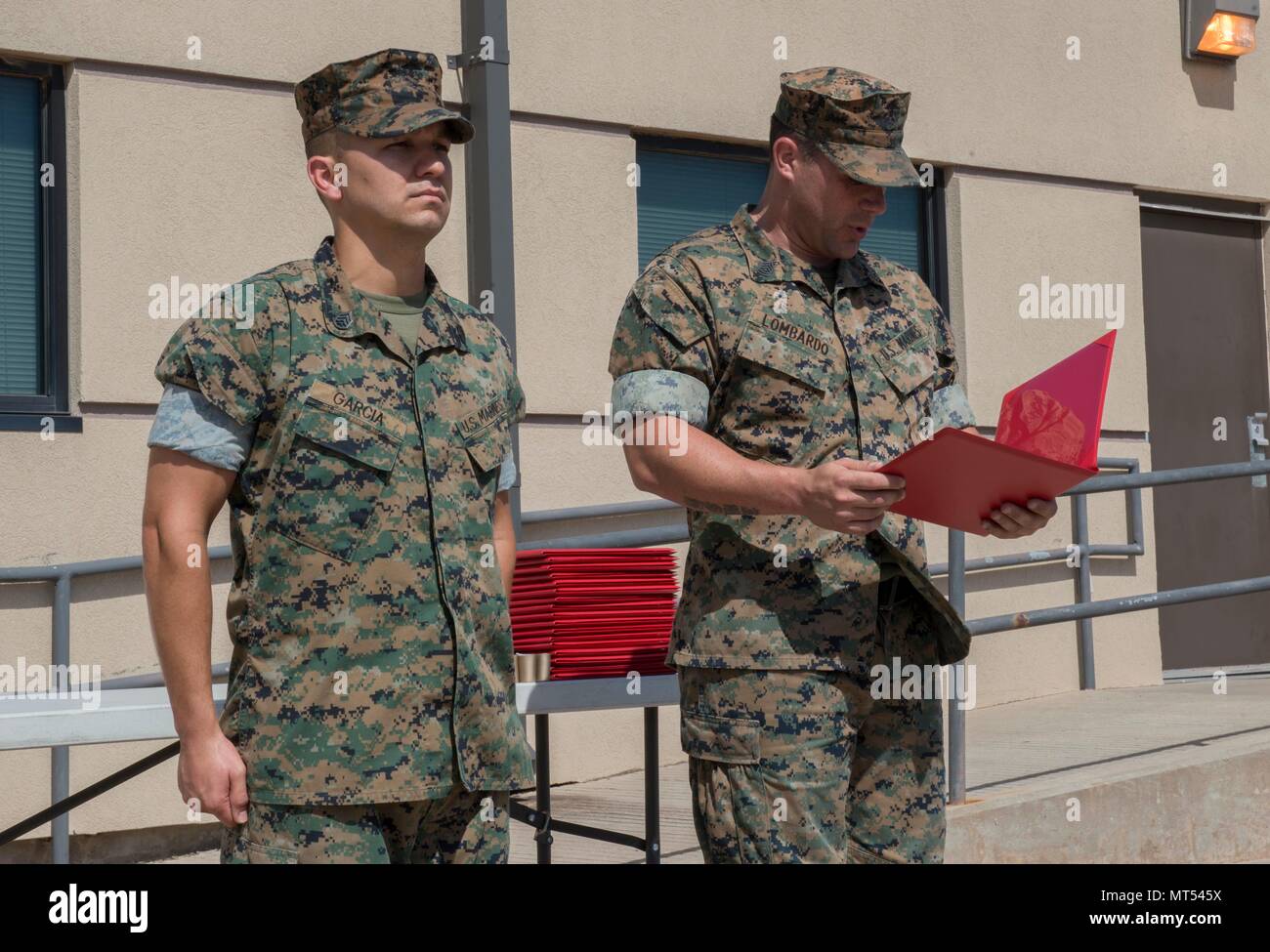 U.S. Marine Corps Staff Sgt. Jason Garcia, left, and Gunnery Sgt ...