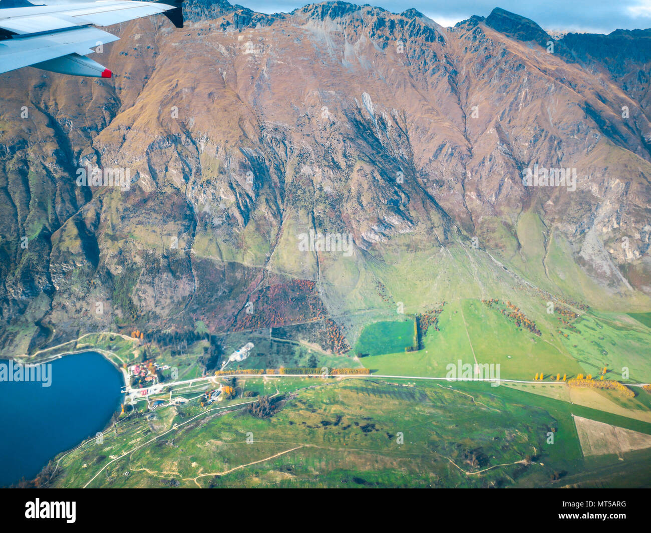 Aerial View from an Airplane Window flying over queenstown New Zealand ...