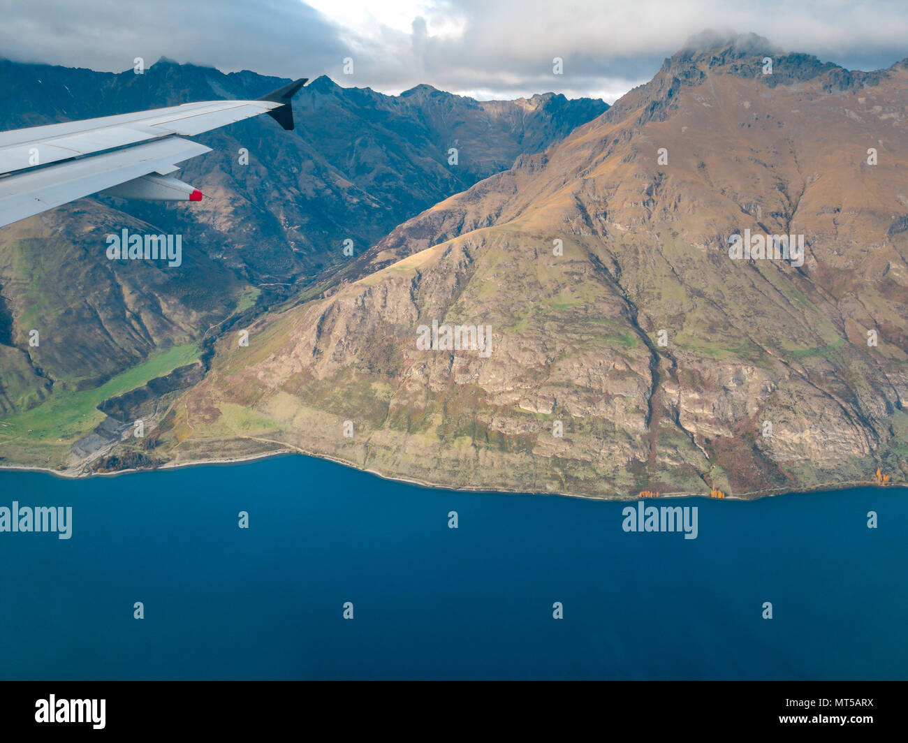 Aerial View from an Airplane Window flying over queenstown New Zealand ...
