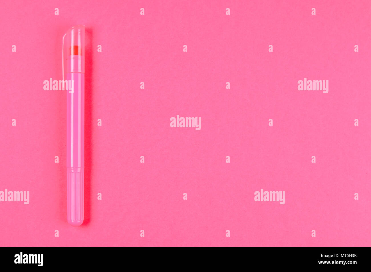 Pink felt-tip pen on a pink pastel background. Summer. Top view. Flat ...