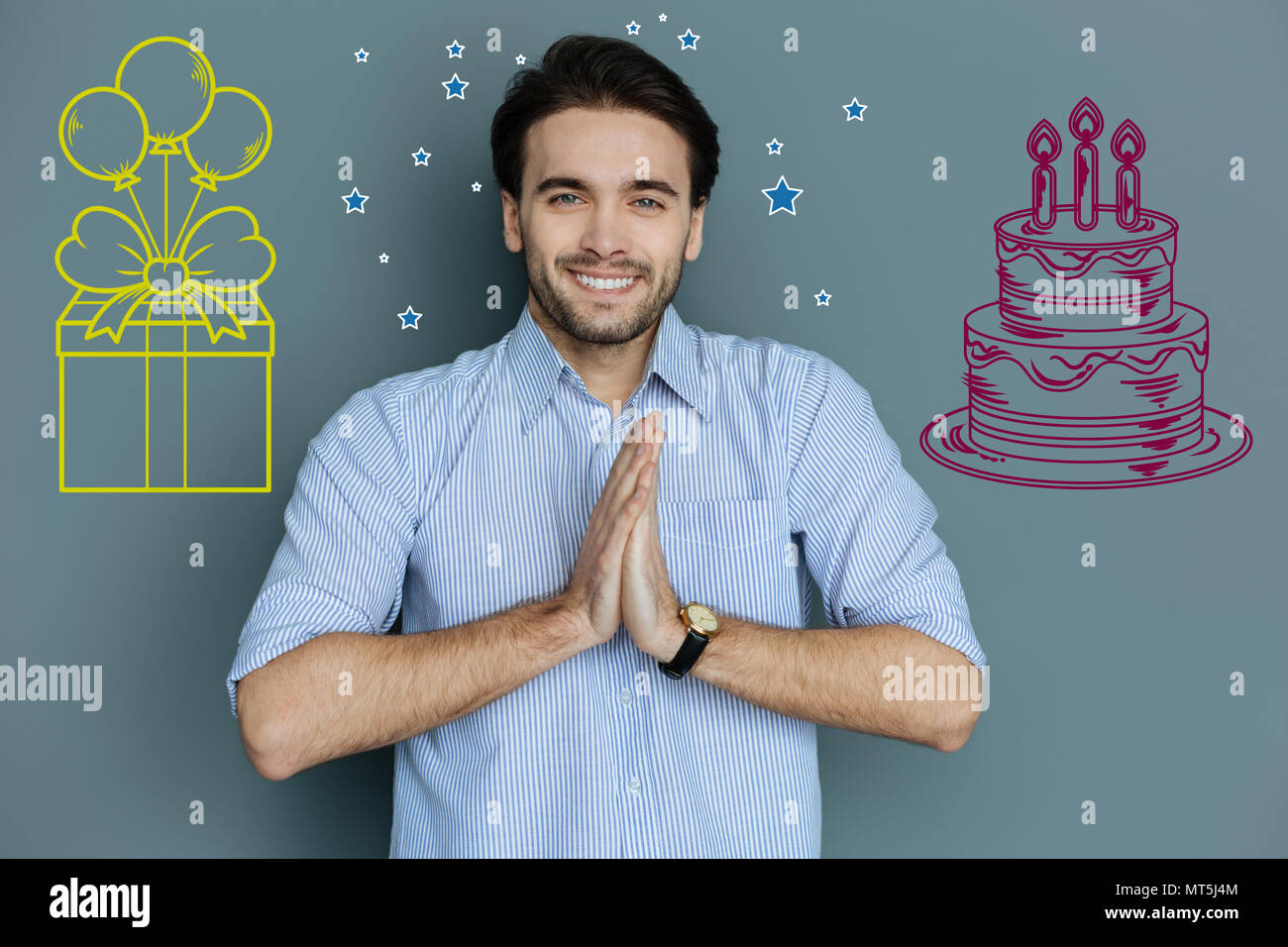 Happy man clapping while having a birthday party Stock Photo - Alamy