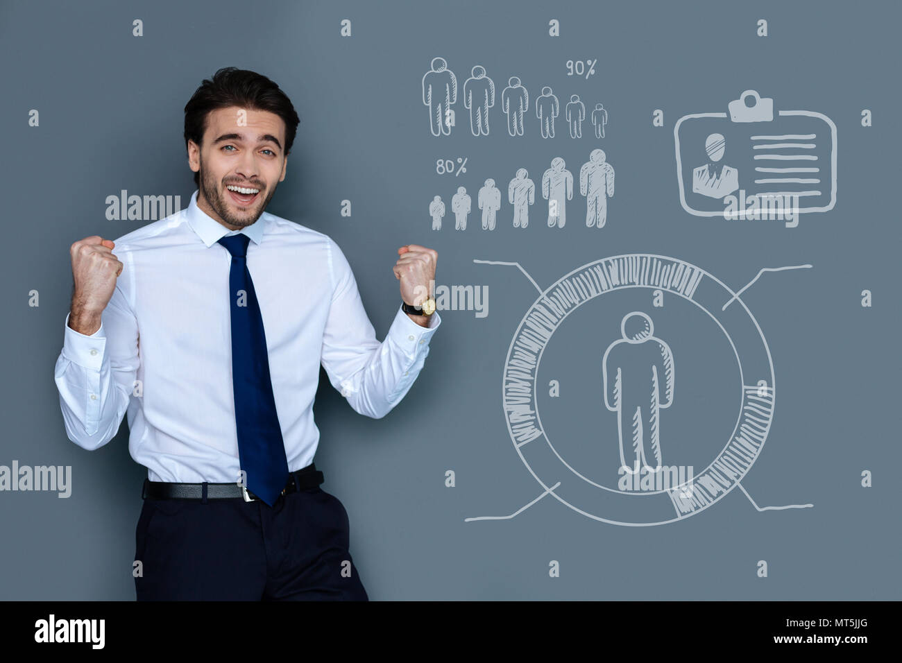 Happy lawyer putting his hands up and feeling successful Stock Photo ...