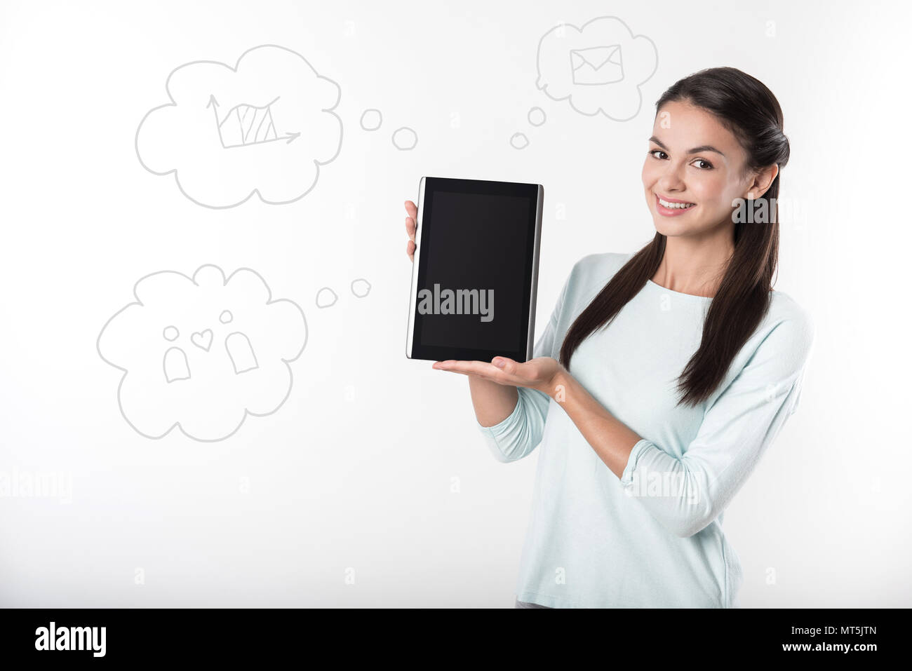 Cheerful web developer smiling and showing a new modern tablet Stock ...