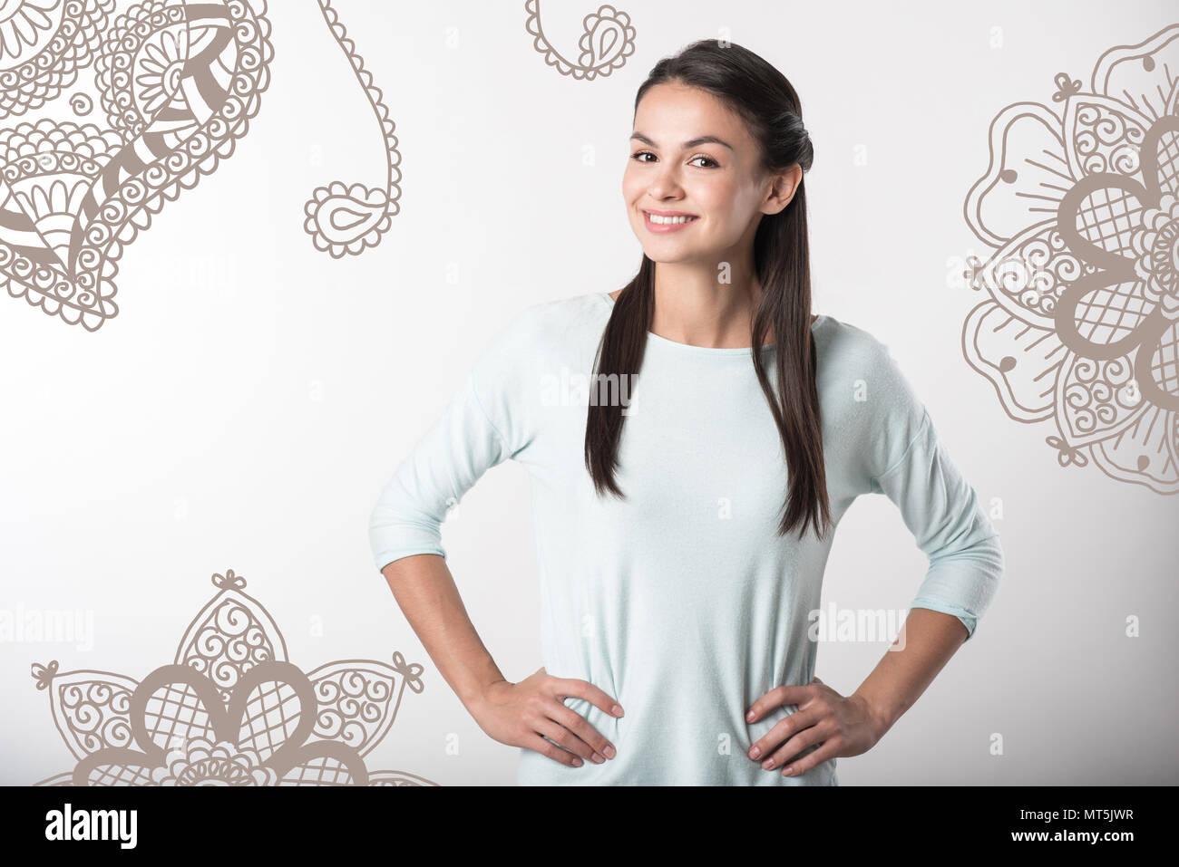Long haired student smiling and looking happy Stock Photo - Alamy