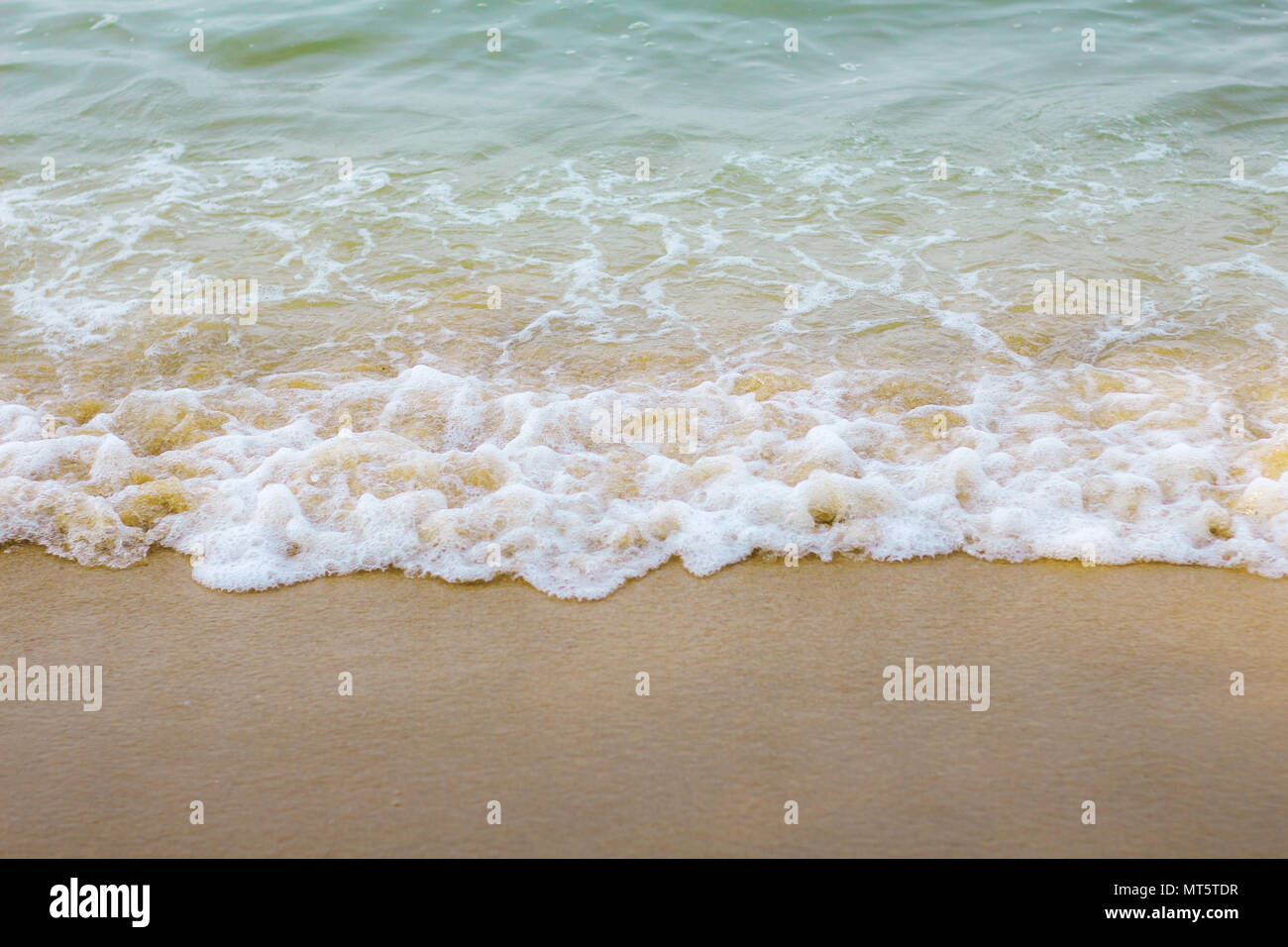 Beach and sea waves with the background Stock Photo - Alamy