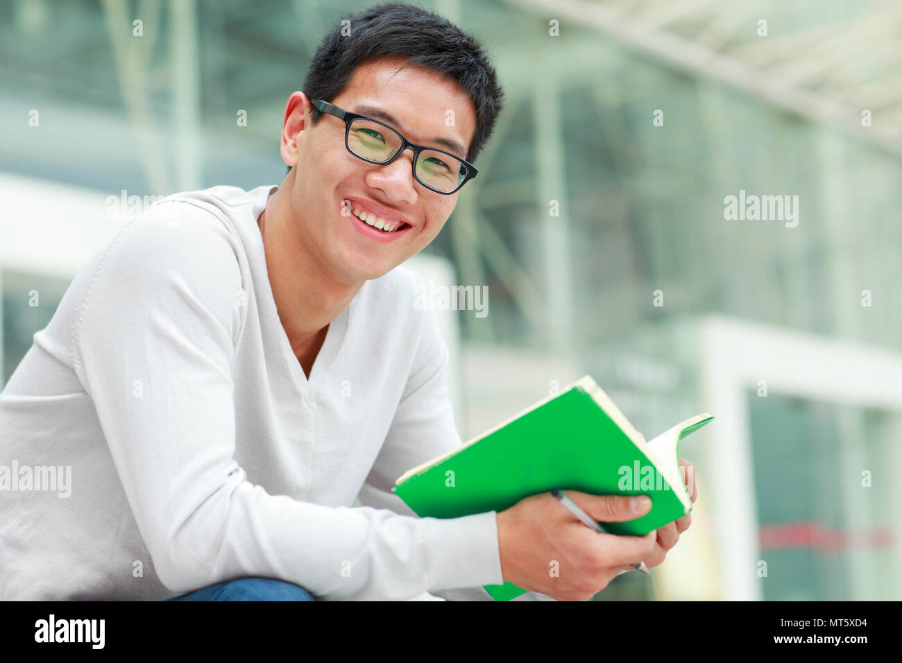 one happy confident young Chinese college student in campus Stock Photo ...