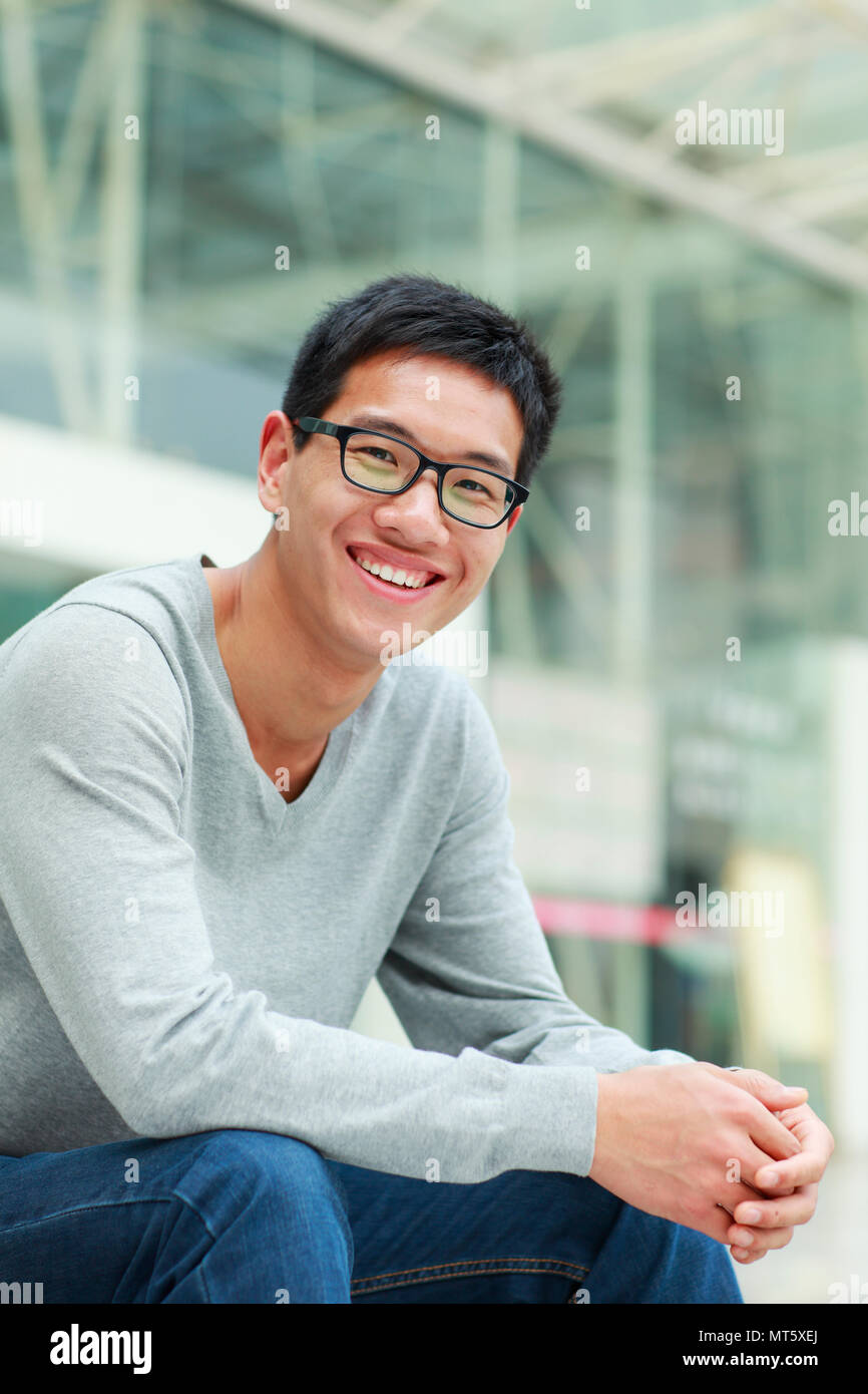 one happy confident young Chinese college student in campus Stock Photo ...