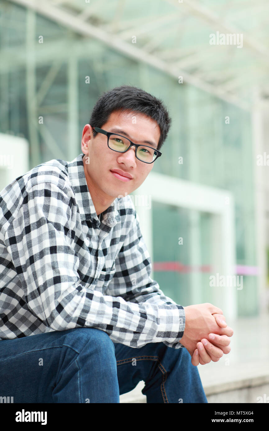 one happy confident young Chinese college student in campus Stock Photo ...