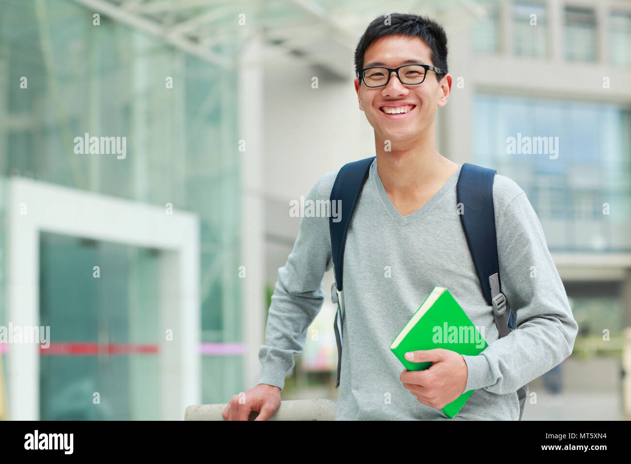 one happy confident young Chinese college student in campus Stock Photo ...