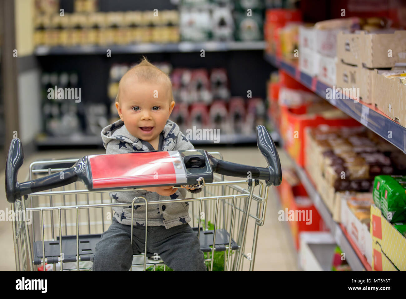 Supermarket shopper child trolley boy hi-res stock photography and ...