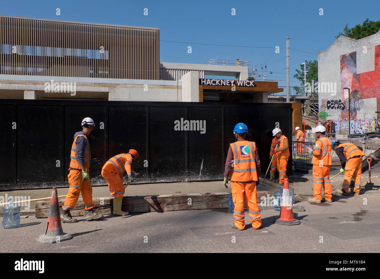 Workers outside the new entrance to the refurbished Hackney Wick ...