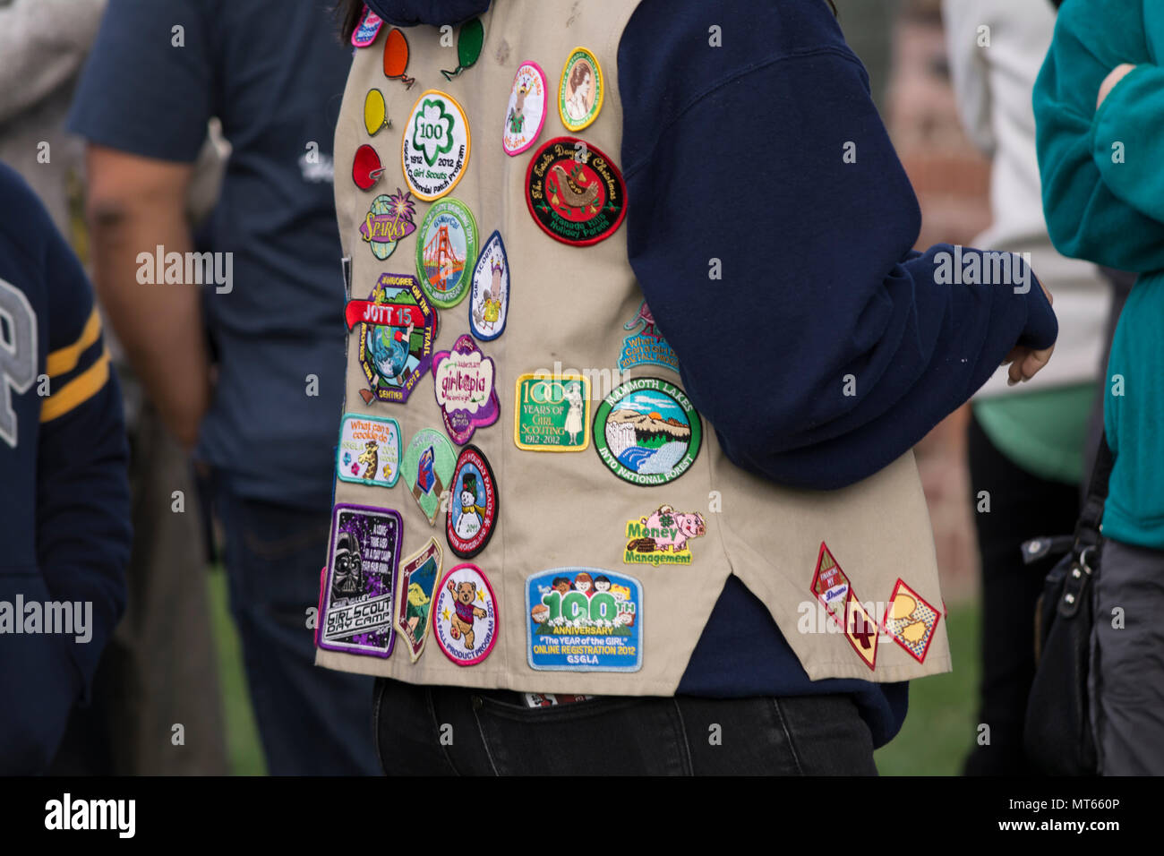 Women wearing a vest with Girl Scouts patches on it Stock Photo - Alamy