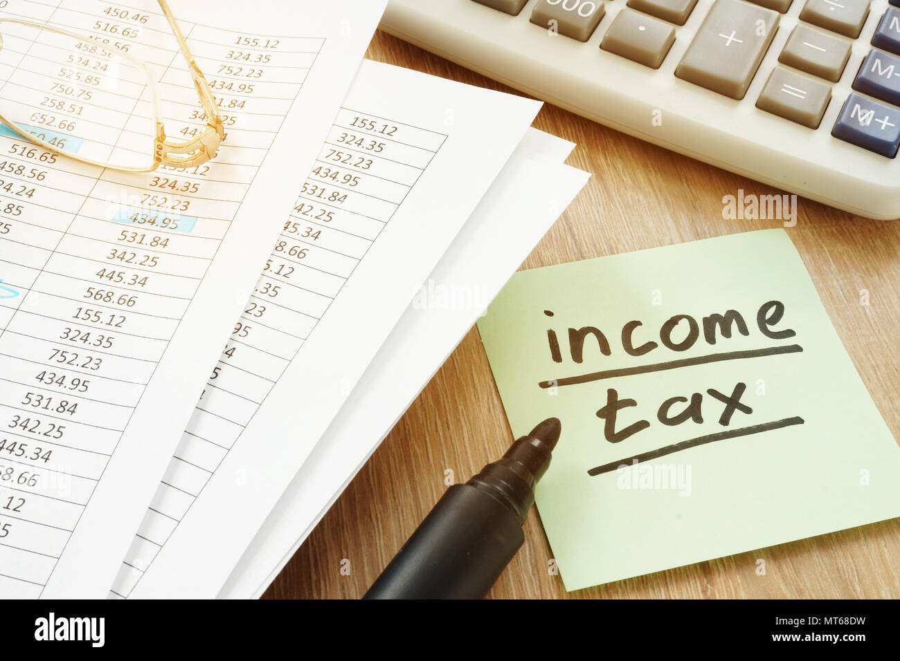Income tax sign and financial report Stock Photo - Alamy