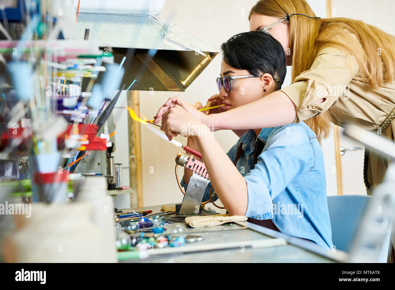 Two Female Artists Collaborating in Glassworking Studio Stock Photo - Alamy