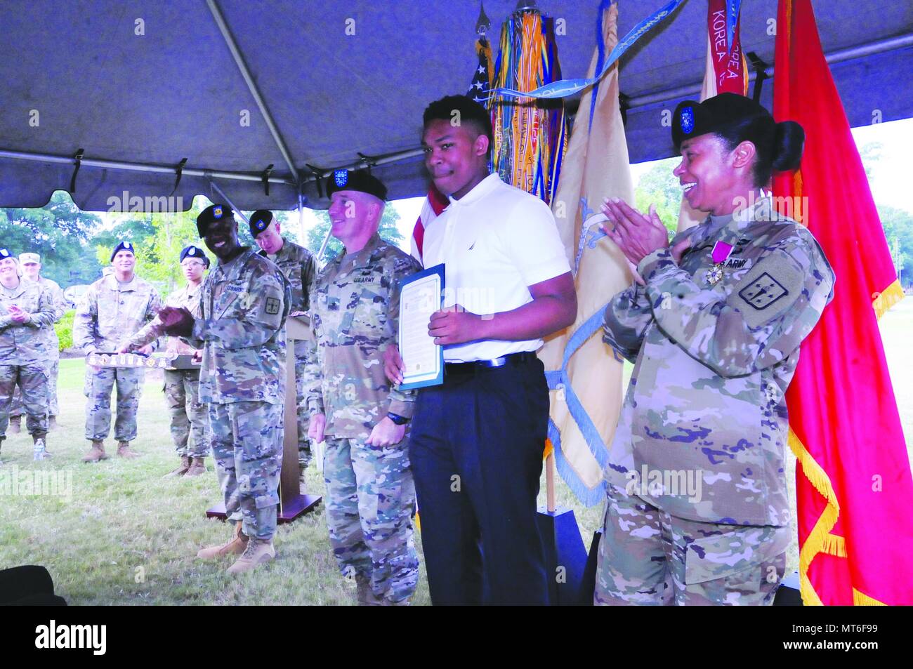 Col. Tamatha Patterson's son, Cody, receives a family member award from ...