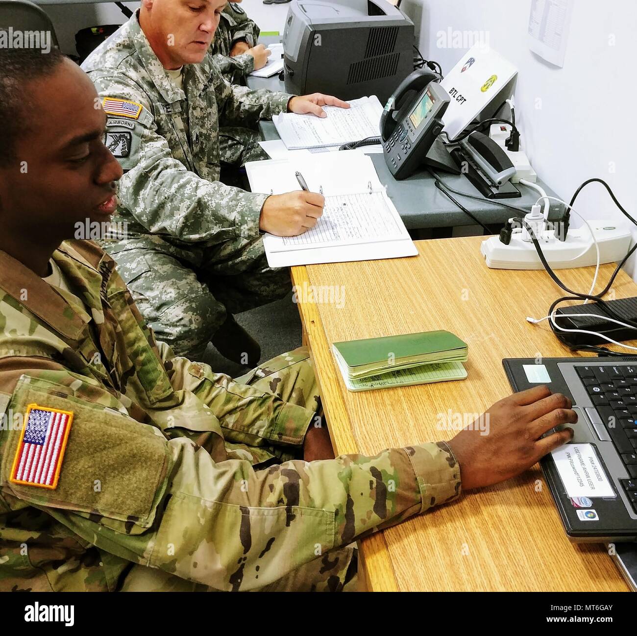 Lt. James Mitchell III (left), a human resources officer with the 230th ...
