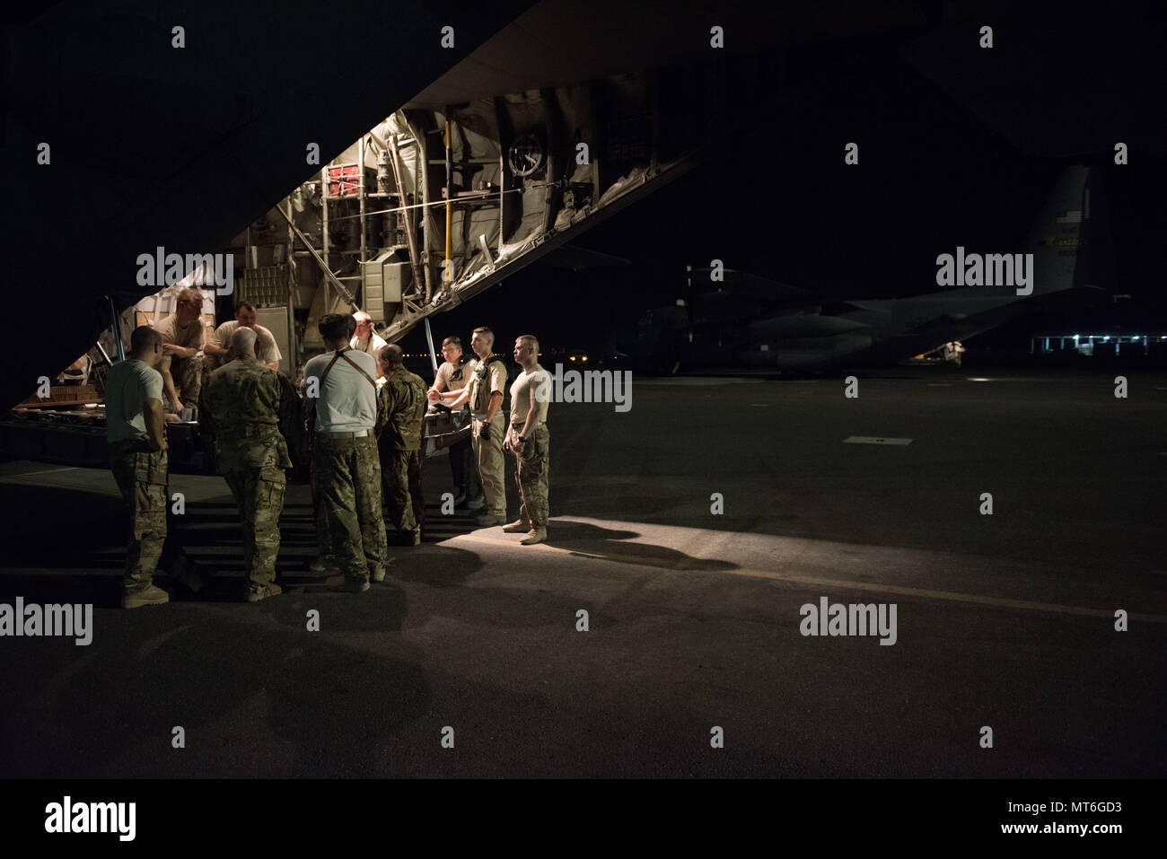 An aircrew assigned to the 737th Expeditionary Airlift Squadron holds a ...