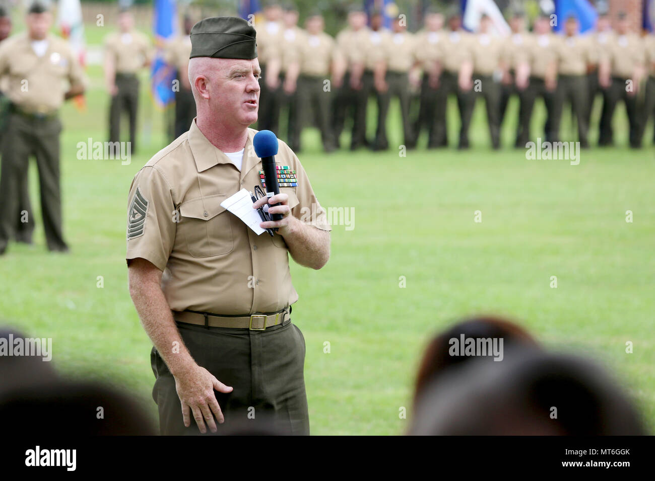 Sgt. Maj. Paul McElearney addresses guests gathered during a post and ...
