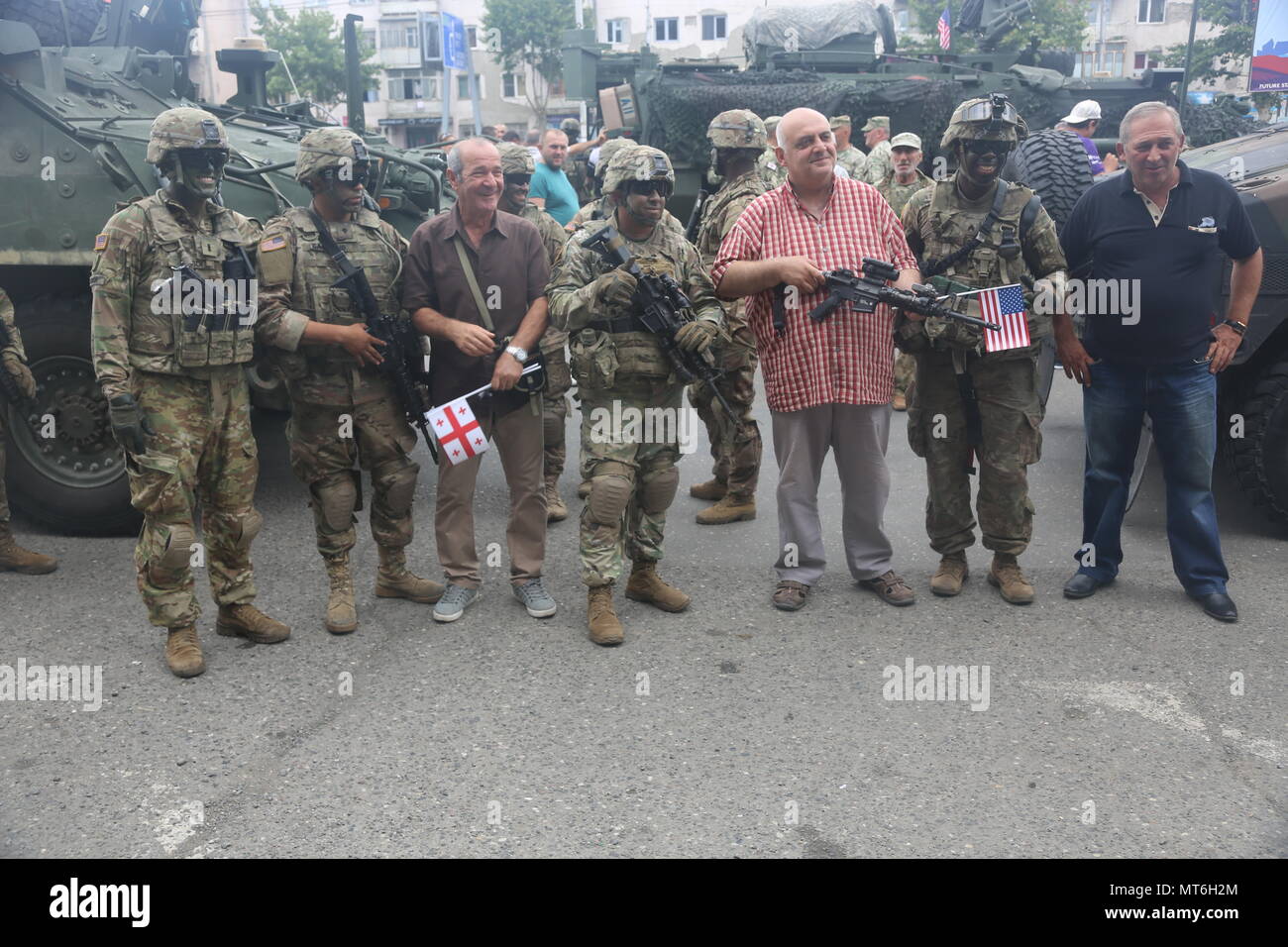 U.S. Army 1st Lt. George Bausch (left), Spc. Antonio Camacho, Staff ...