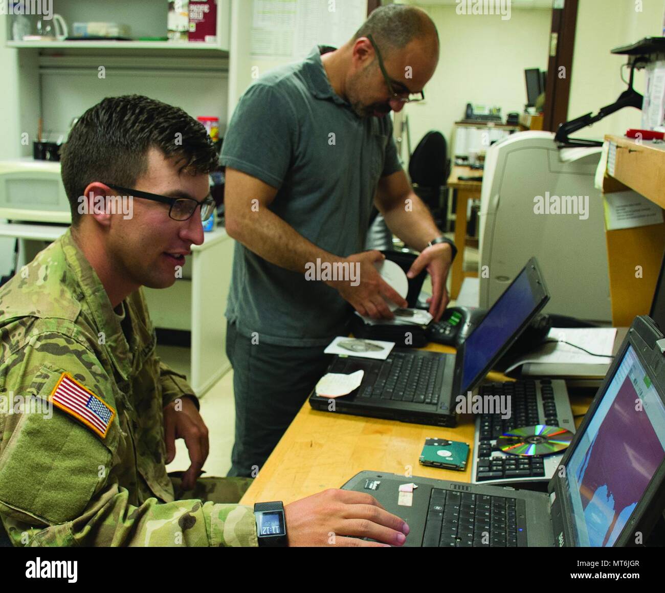Tobyhanna Army Depot’s Sam Omari, right, provides over-the-shoulder ...