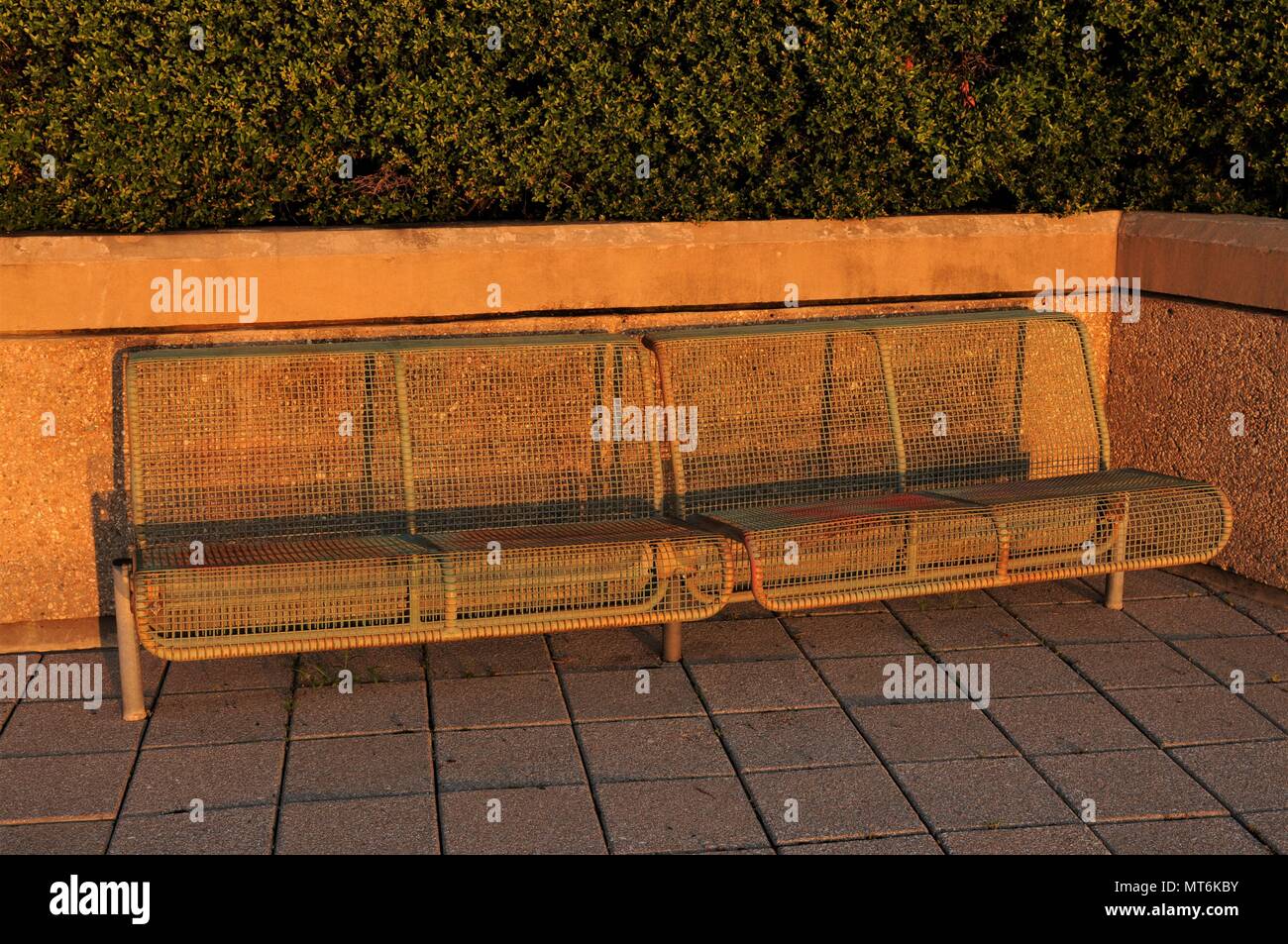 Old rusty park benches in early morning light Stock Photo - Alamy