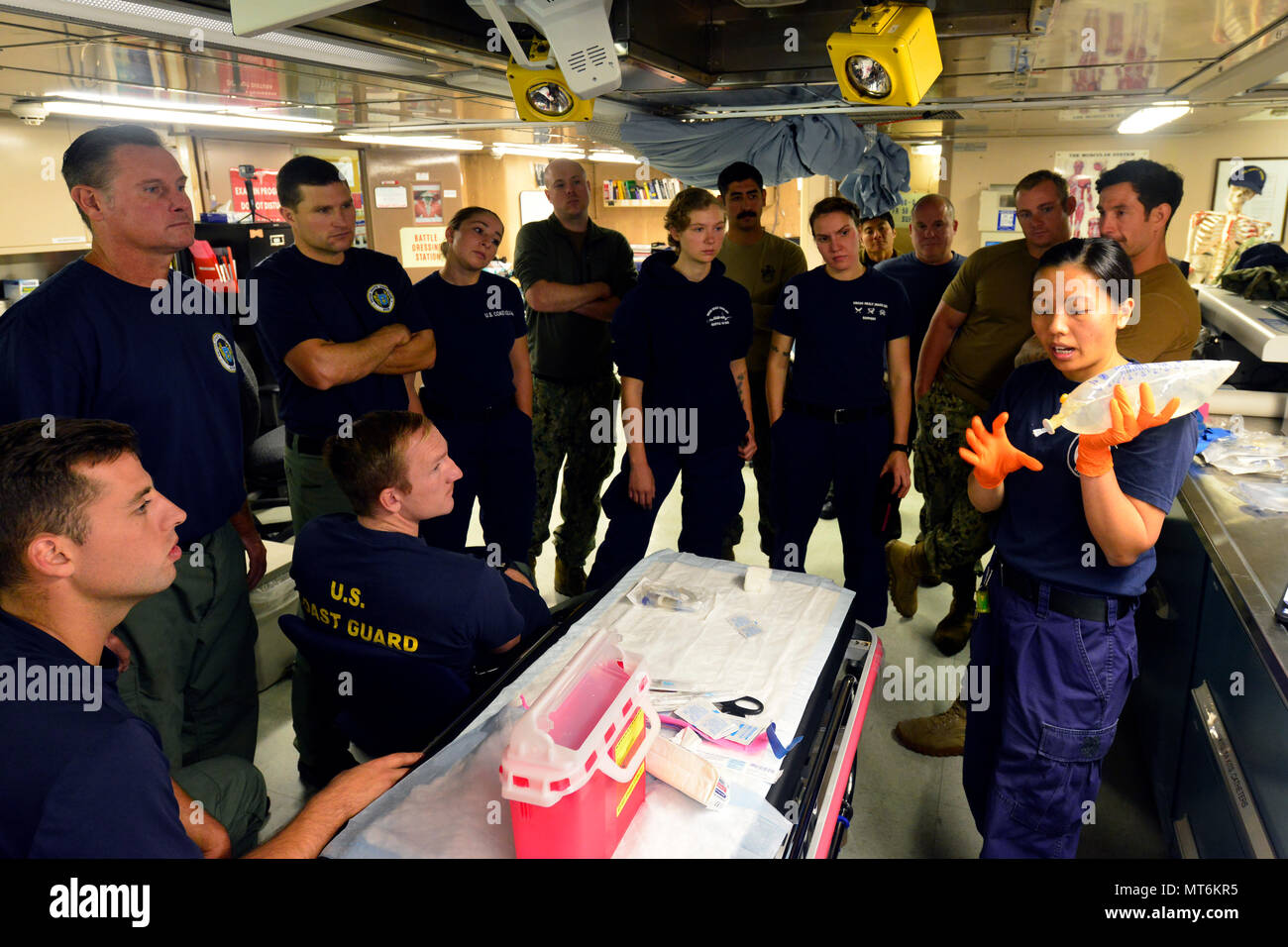 Petty Officer 1st Class Kim Nguyen, a health service specialist onboard ...