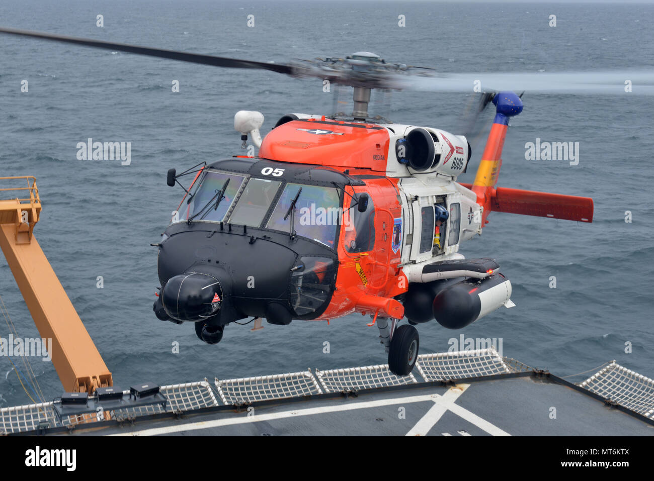 An Air Station Kodiak MH-60 Jayhawk helicopter prepares to land on the ...