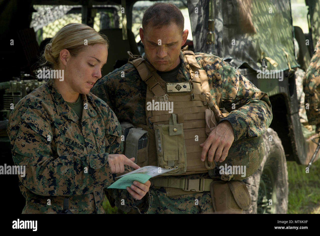 U.S. Marine Corps 1st Lt. Kate A. Pearson, left, a field artillery ...