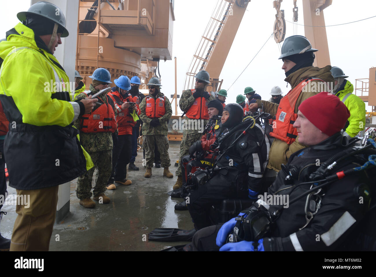 Chief Petty Officer Chuck Ashmore (far left) conducts a safety brief ...