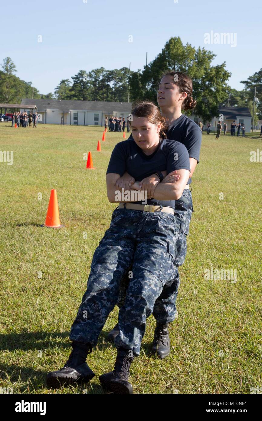 A U.S. Naval ROTC Midshipman demonstrates the buddy drag during Career ...