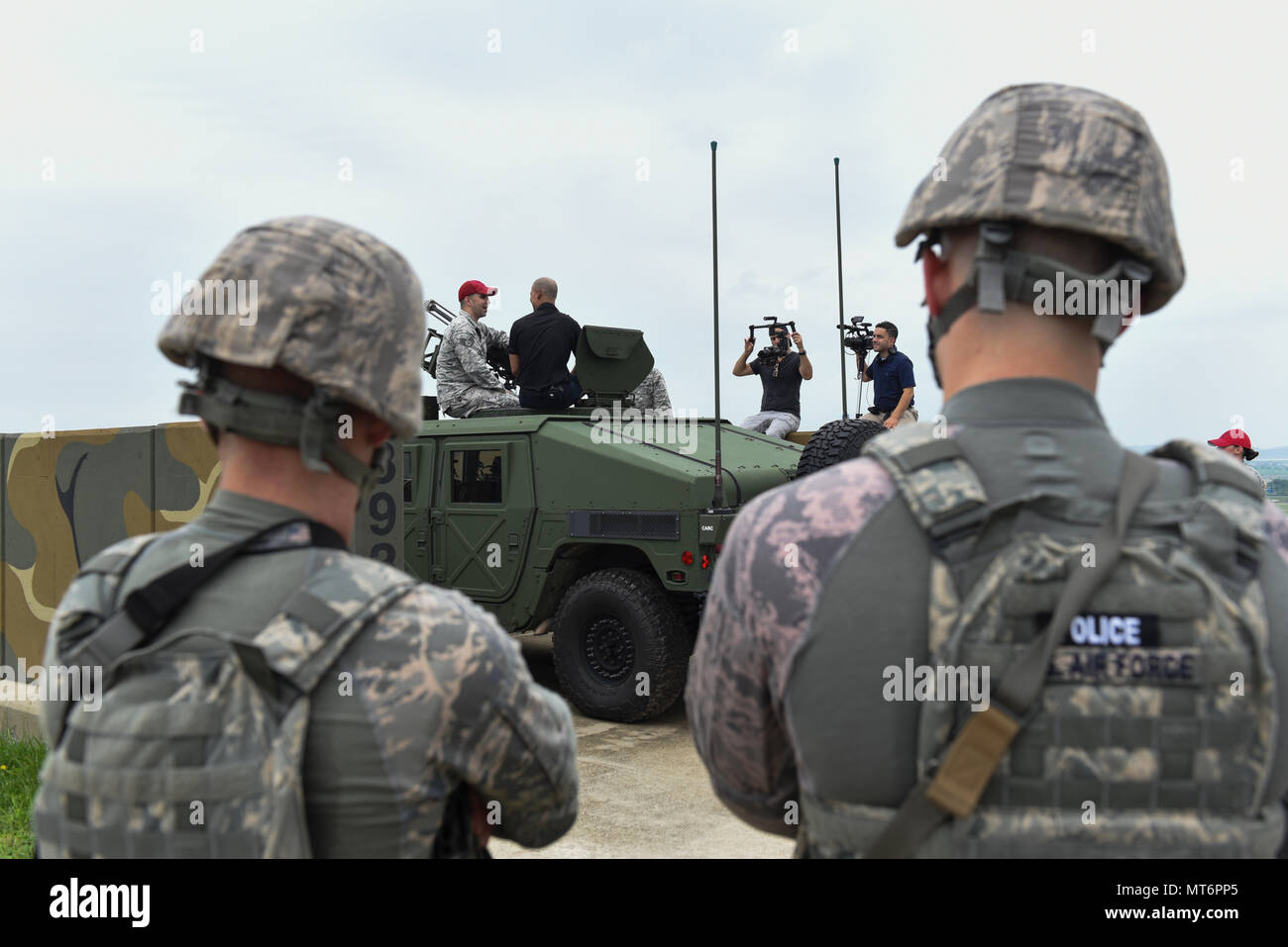 8th Security Forces members look on as Vladimir Duthiers, CBS News ...