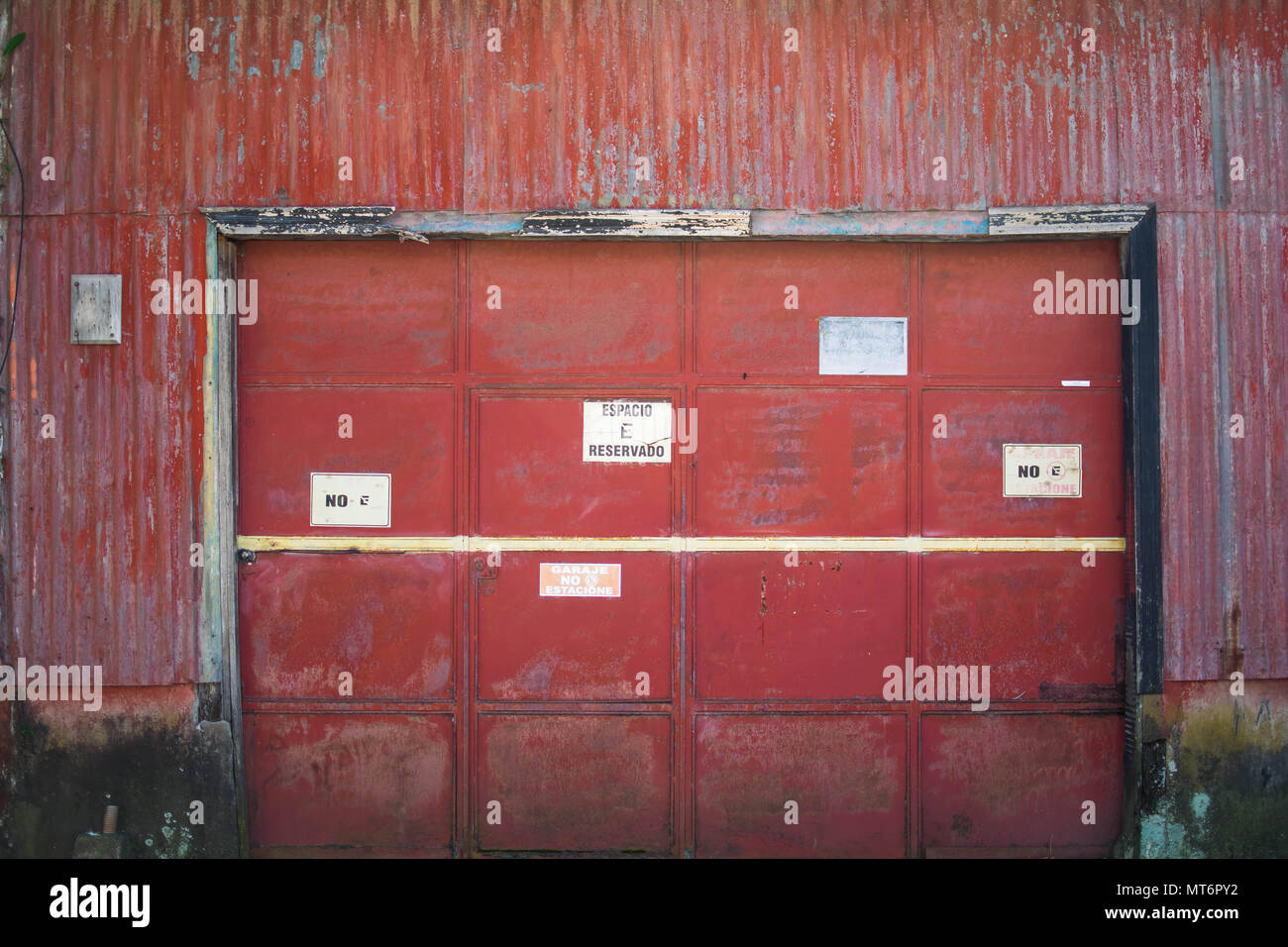 San Jose, Costa Rica. February 2, 2018. A red garage with a reserved ...