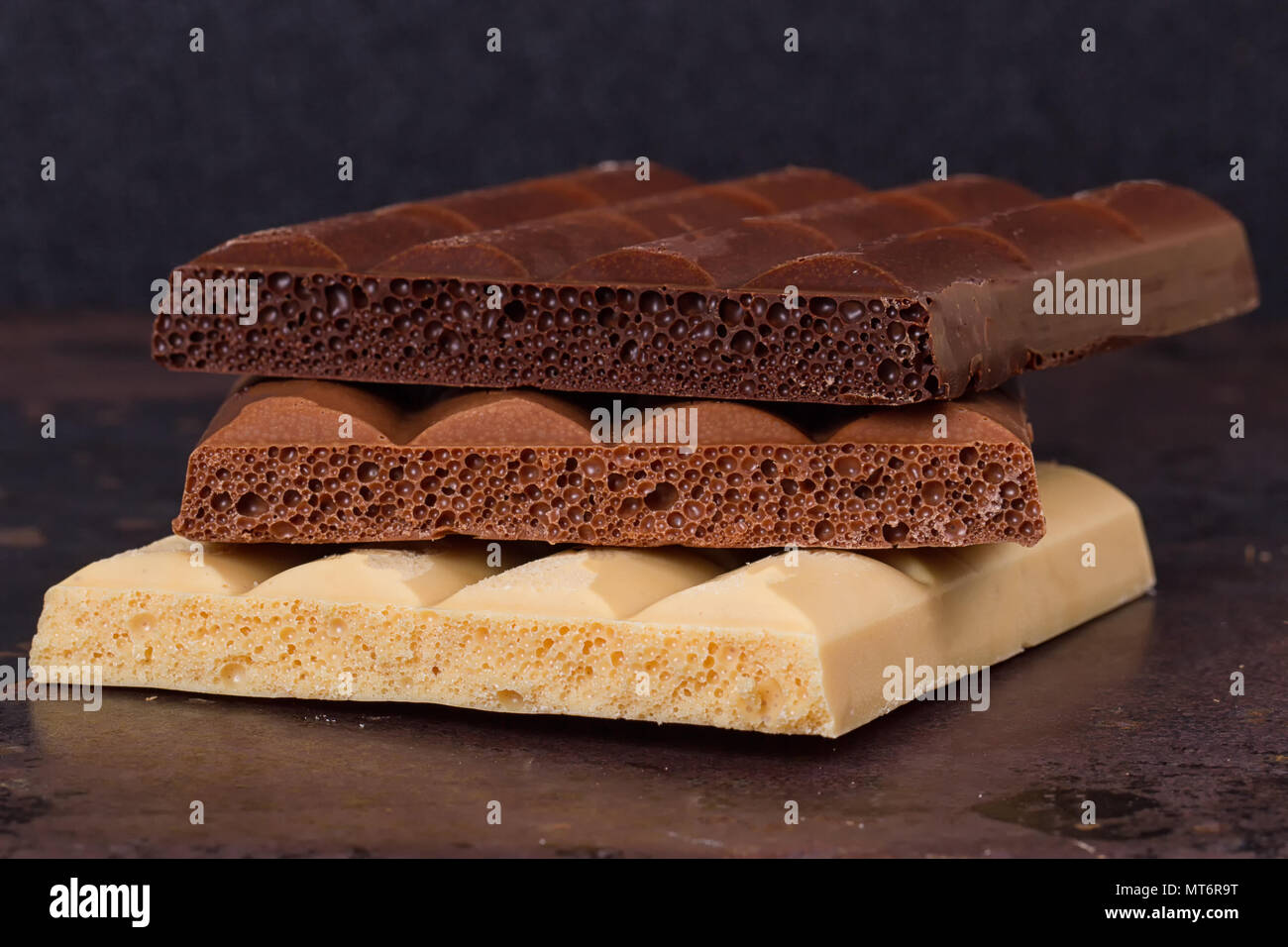 milk, dark and white chocolate bars on grunge background Stock Photo ...