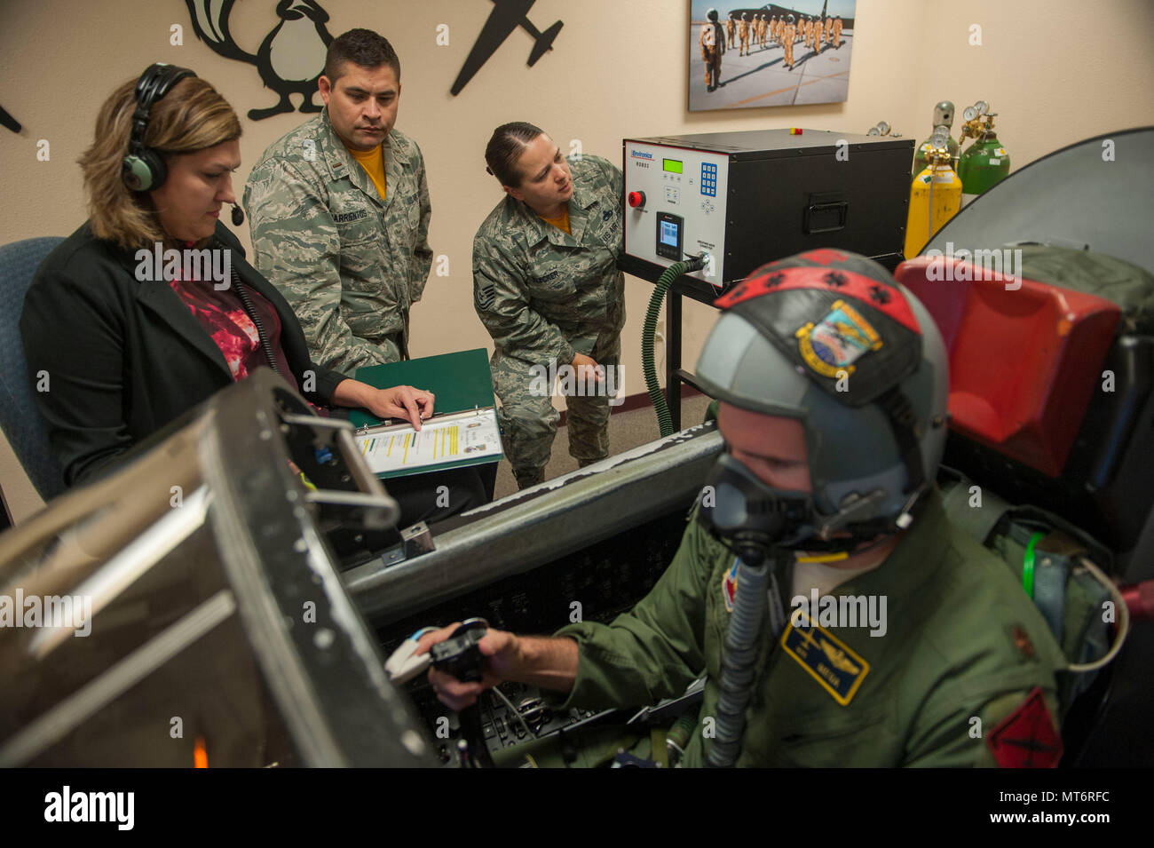 9th Physiological Support Squadron personnel monitor a pilot's vitals ...