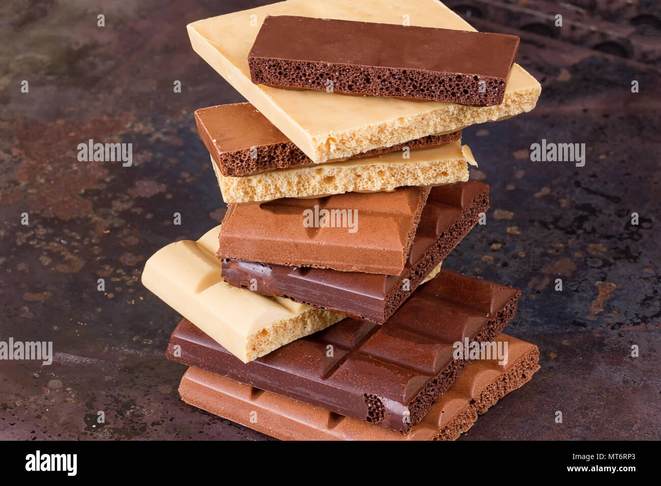 milk, dark and white chocolate bars on grunge background Stock Photo ...