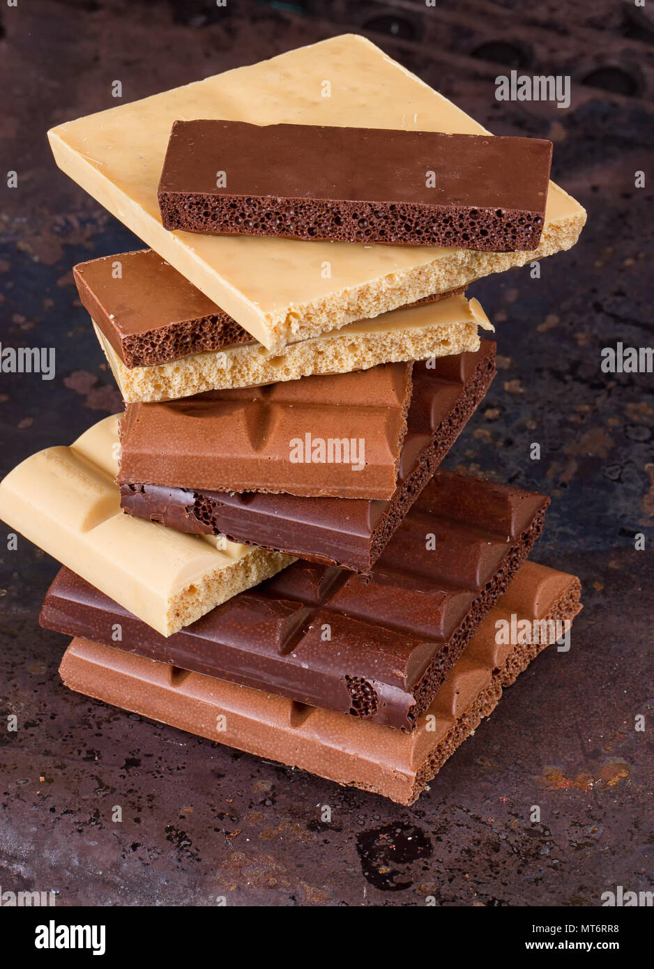 milk, dark and white chocolate bars on grunge background Stock Photo ...