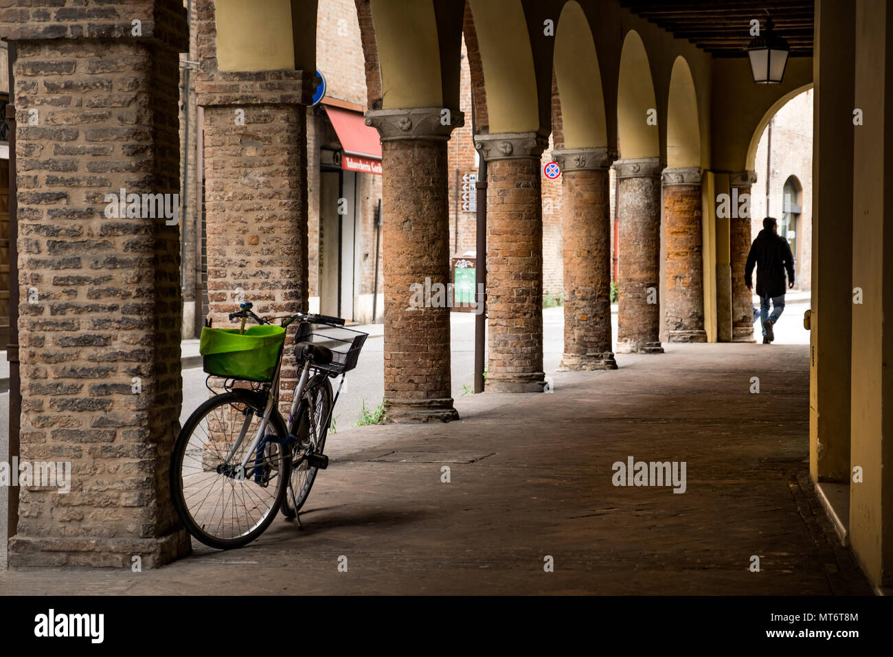 FERRARA, ITALY - May 01, 2018: unknown people arched portico of the ...
