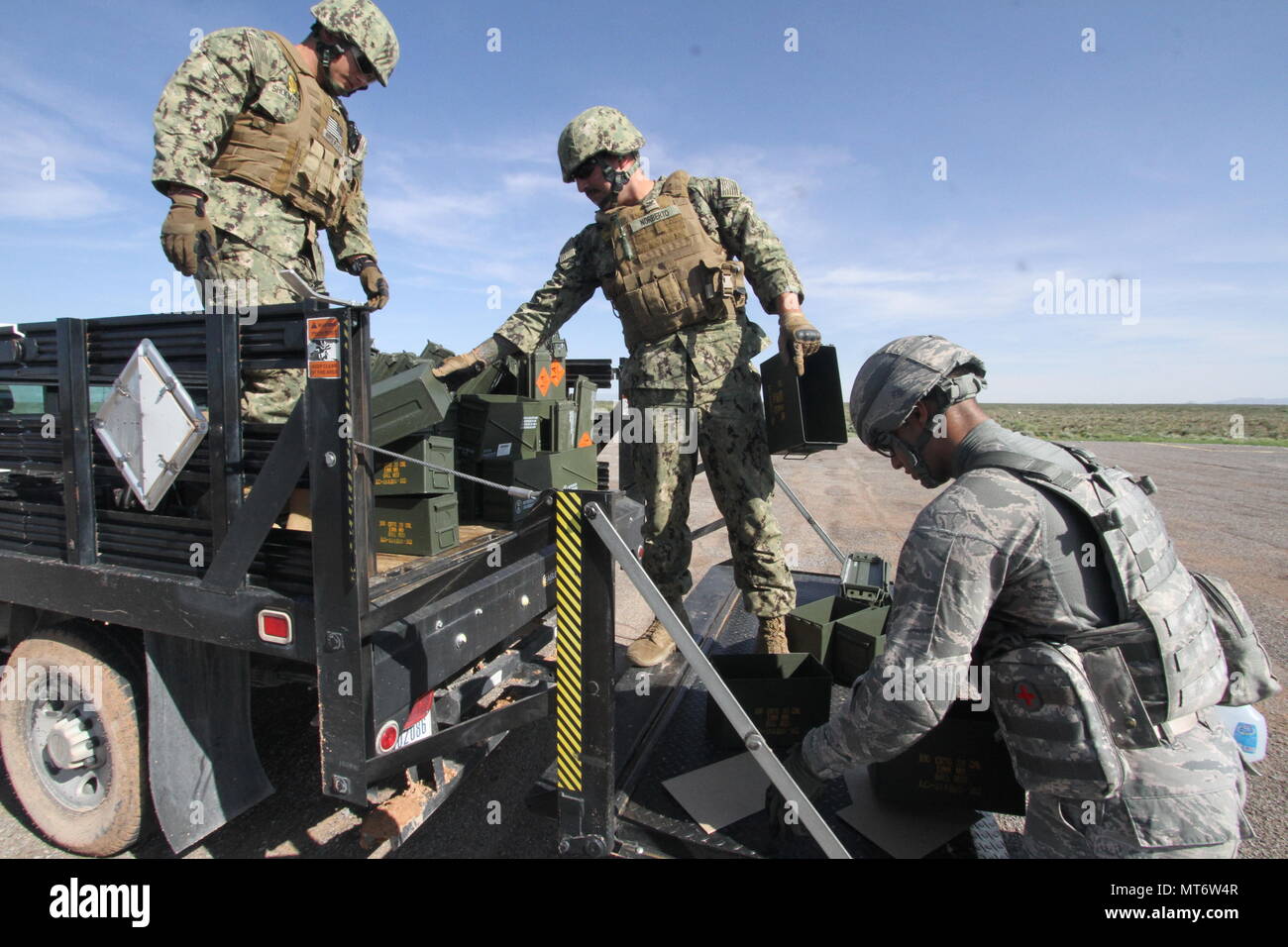 From left, U.S. Navy Petty Officers 2nd Class Zachary Shoemaker and ...