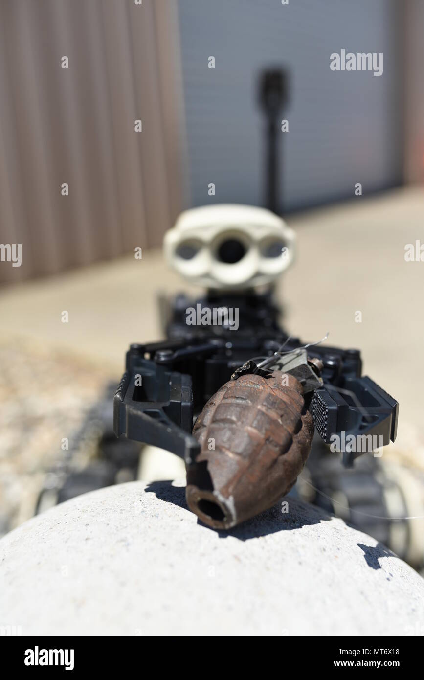 A Micro Tactical Ground Robot captures a mock grenade during EOD ...