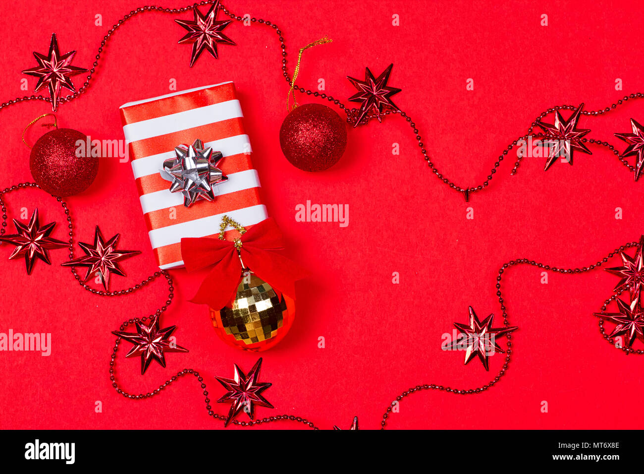 Christmas red background with gift and decoration on the red background ...