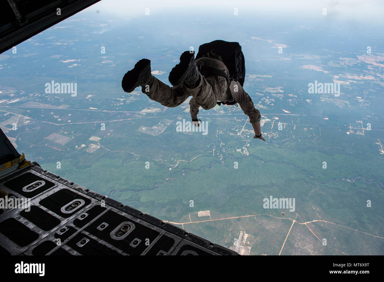 U.S. Navy Sea, Air, and Land Team Members conduct military free fall ...