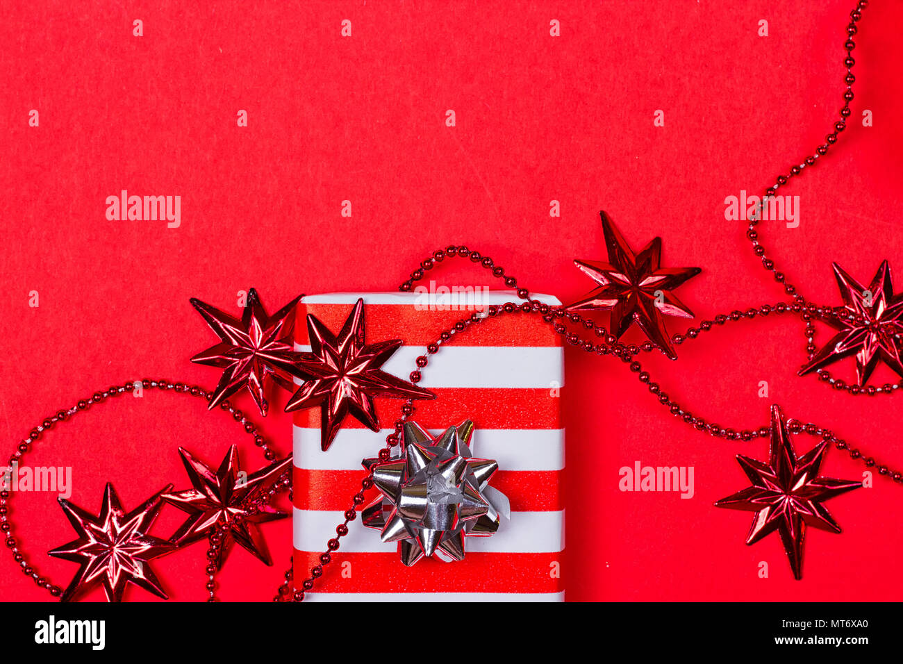 Christmas red background with gift and decoration on the red background ...