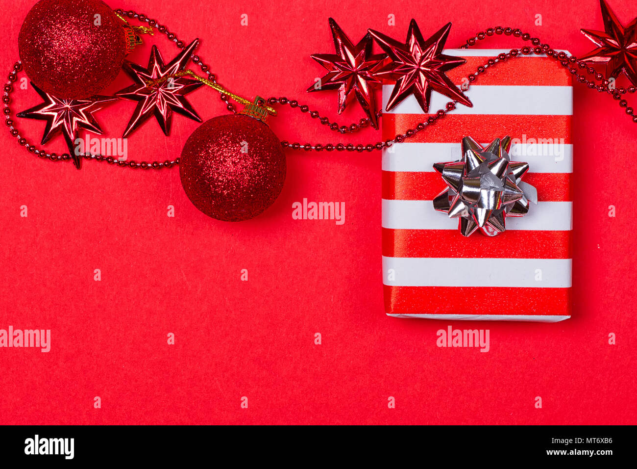 Christmas red background with gift and decoration on the red background ...
