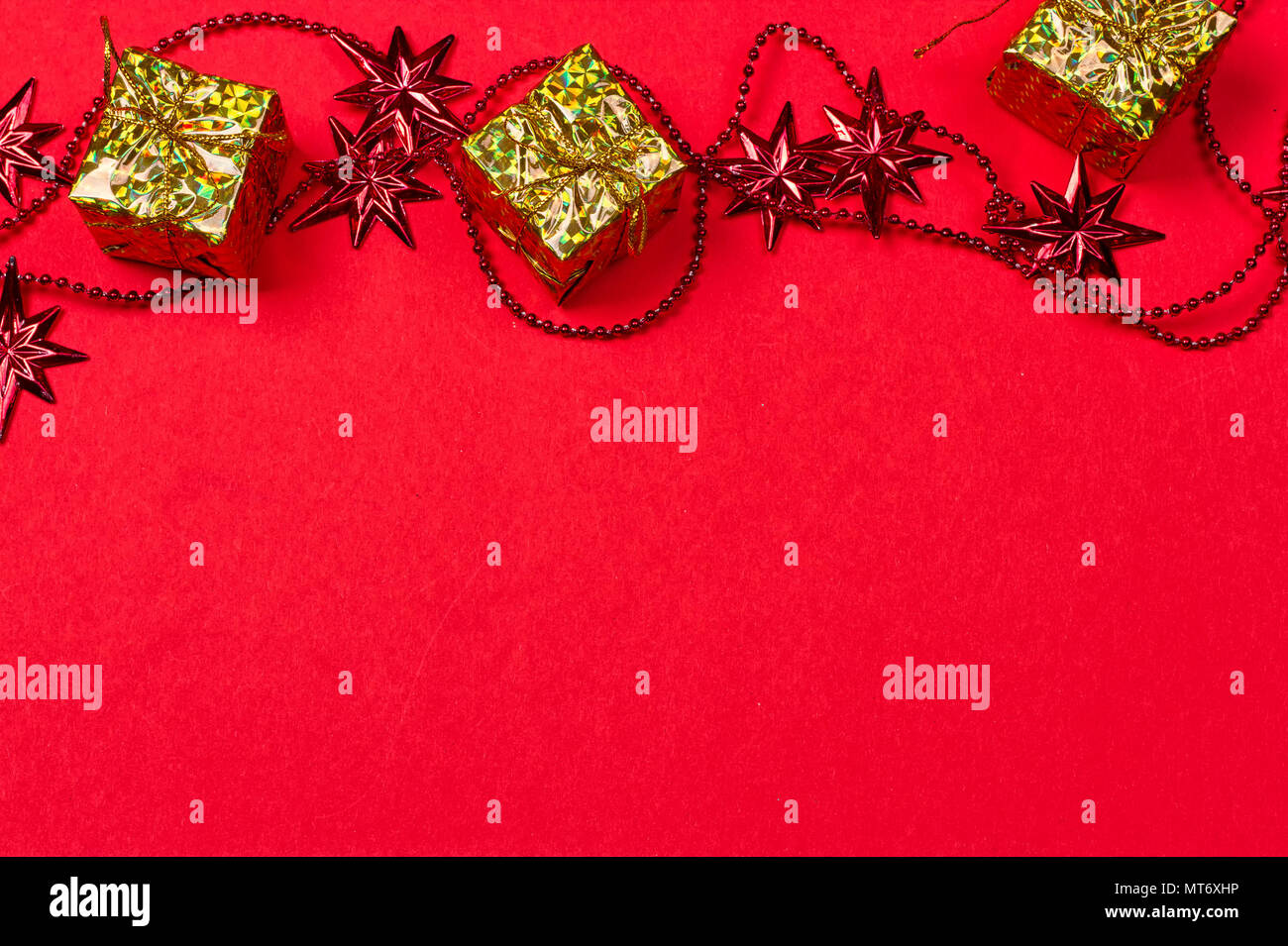 Christmas red background with gift and decoration on the red background ...