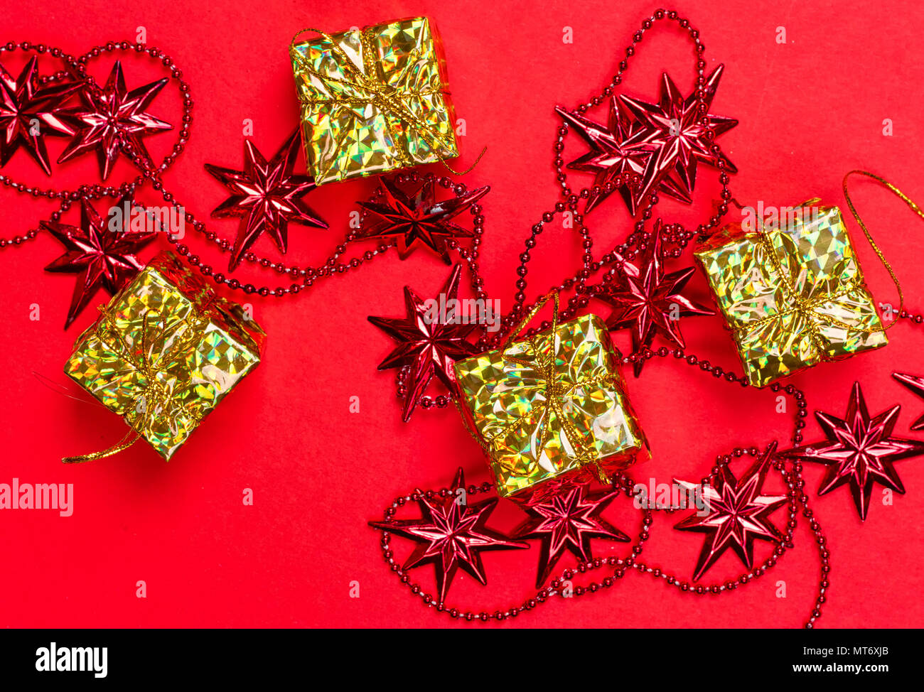 Christmas red background with gift and decoration on the red background ...