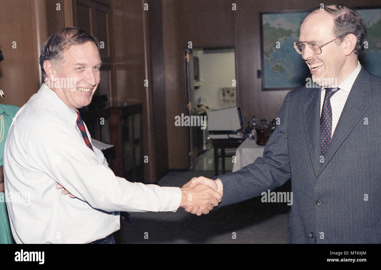 TWO MEN GREETING EACH OTHER WITH A HAND SHACK Stock Photo - Alamy