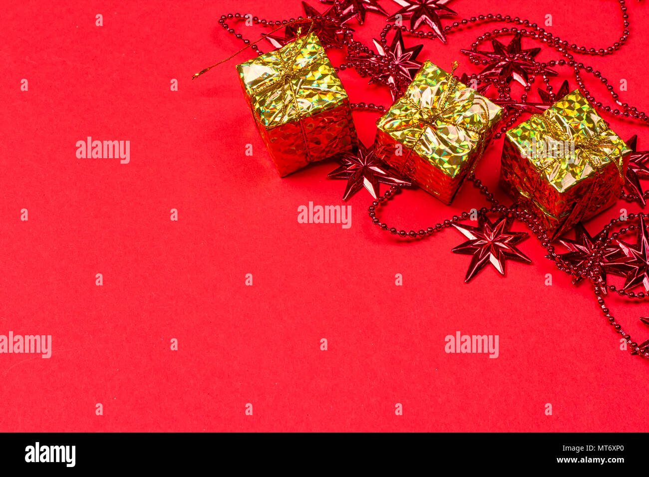 Christmas red background with gift and decoration on the red background ...